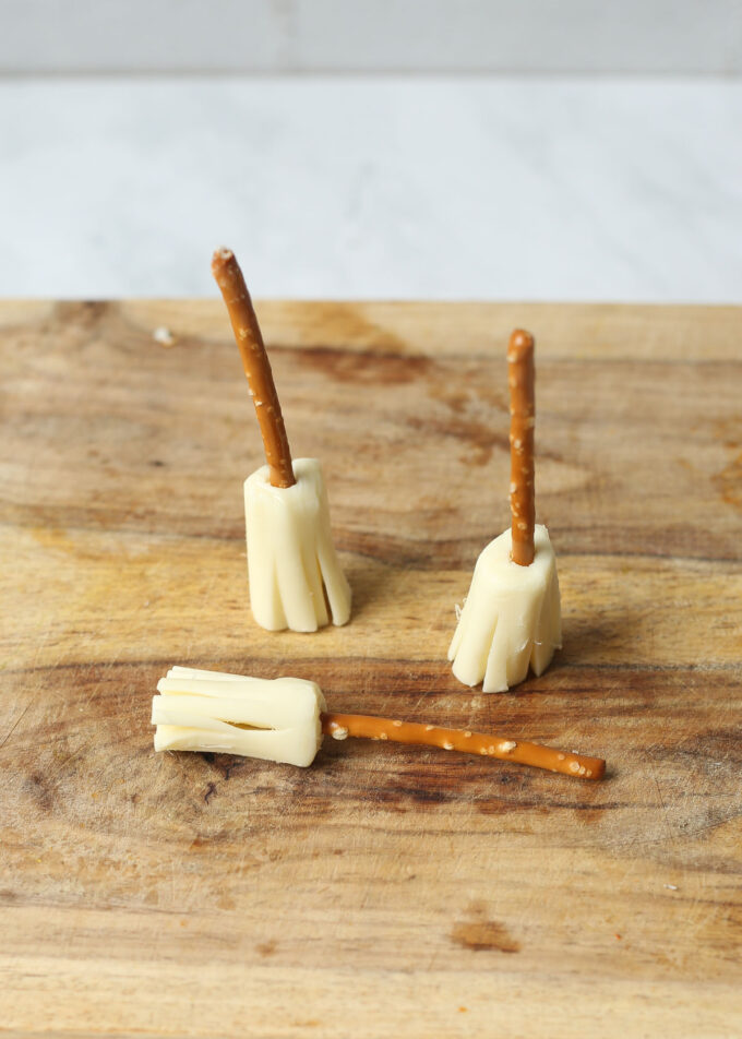 String Cheese Pretzel Broomsticks